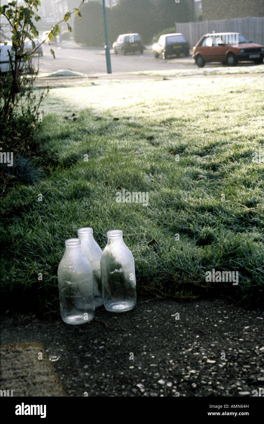 Three Empty milk bottles on cold frosty morning Stock Photo - Alamy
