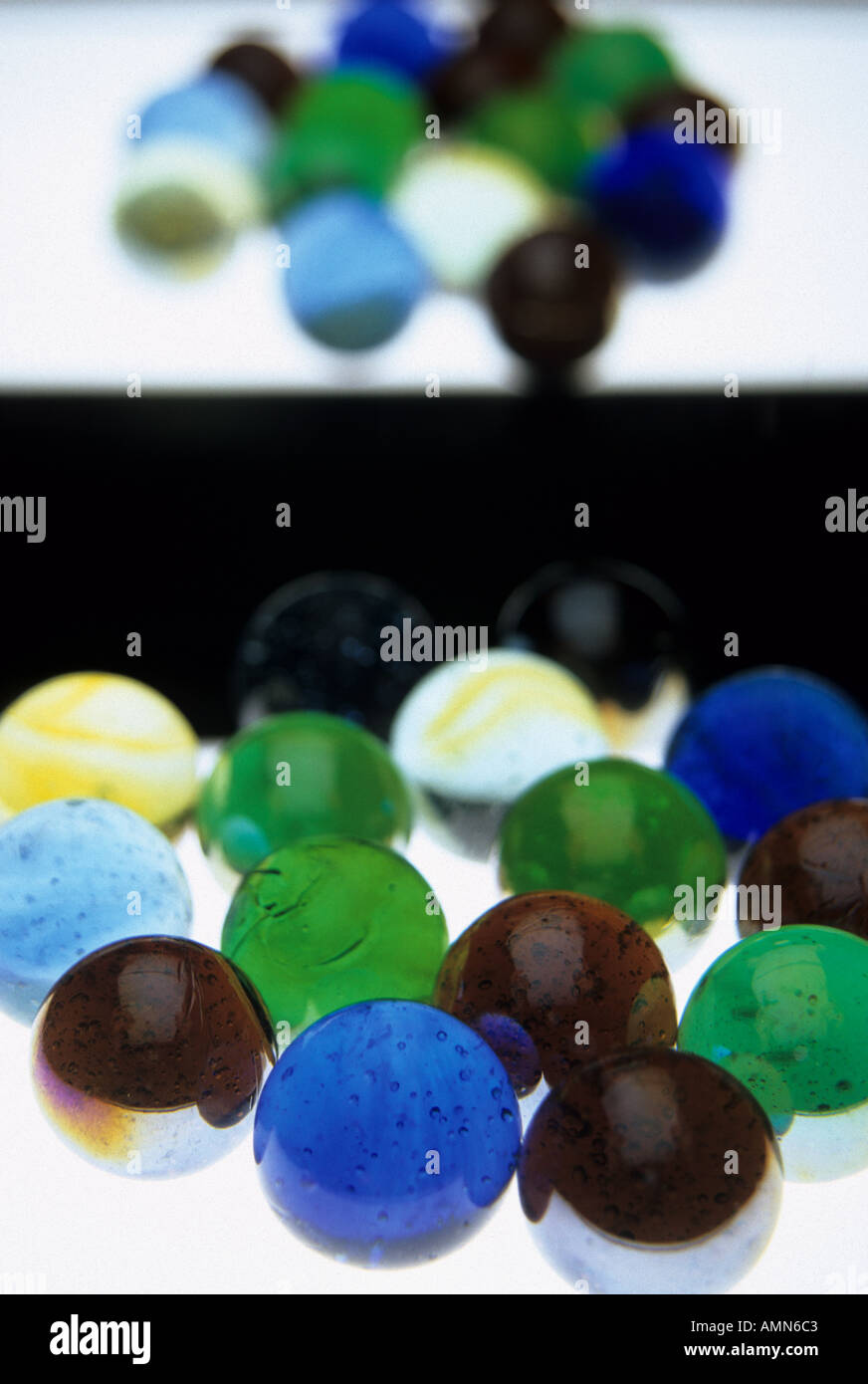 Marbles and their reflection Stock Photo - Alamy