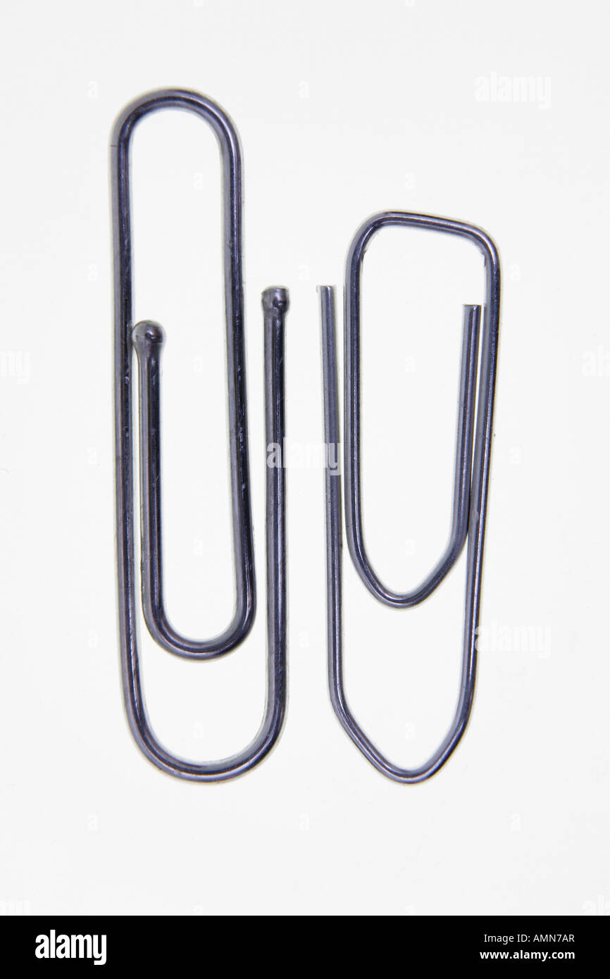 Two paper clips on white background Stock Photo - Alamy