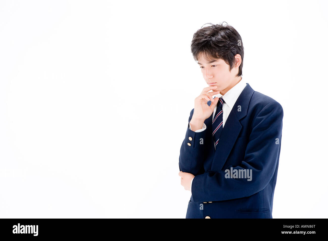 Teenage boy thinking Stock Photo - Alamy