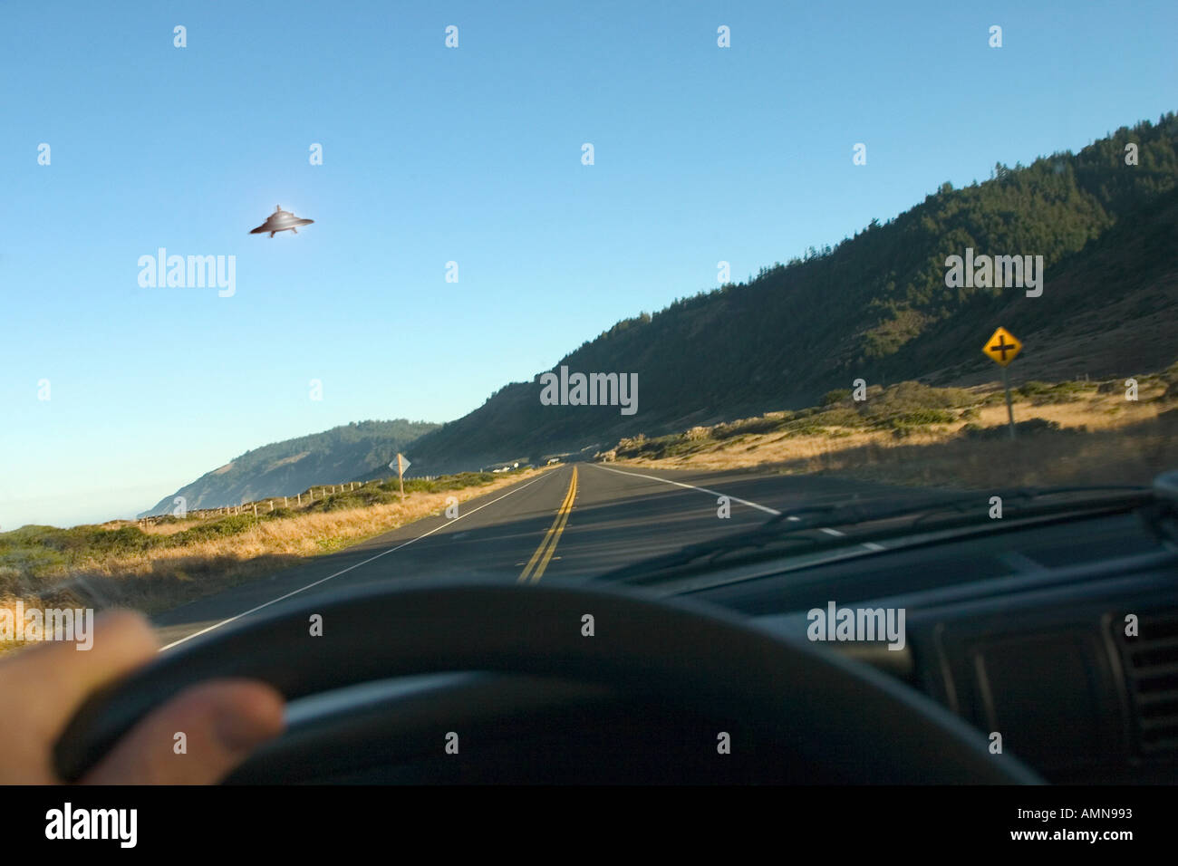 UFO sighting through car windshield Stock Photo - Alamy
