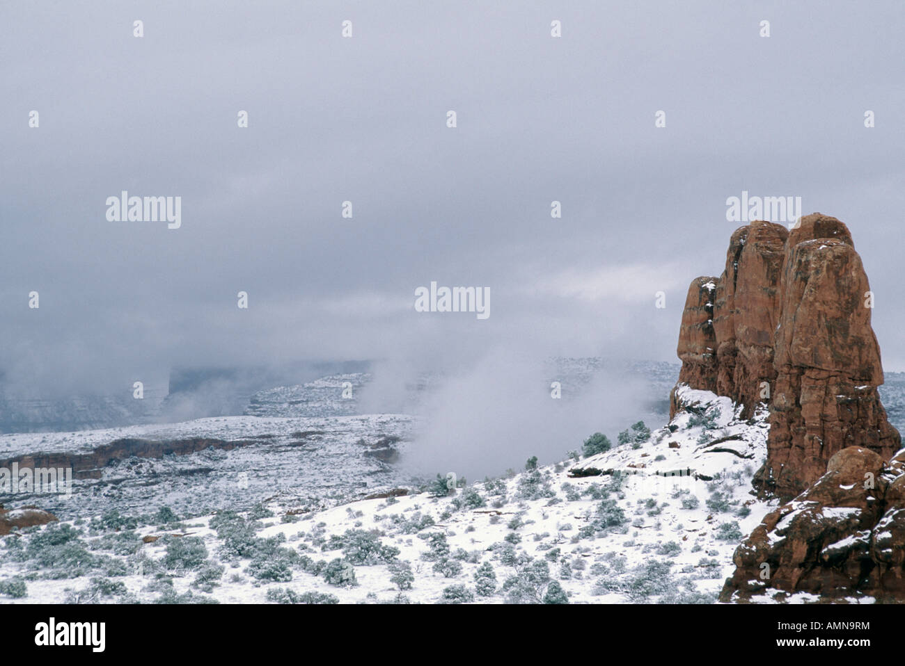low clouds of a winter storm, Arches National Park, Utah USA Stock ...