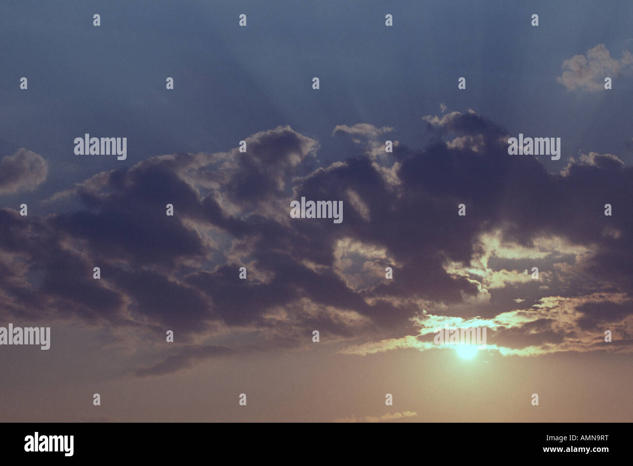 sunbeams, cloud and sun Stock Photo - Alamy