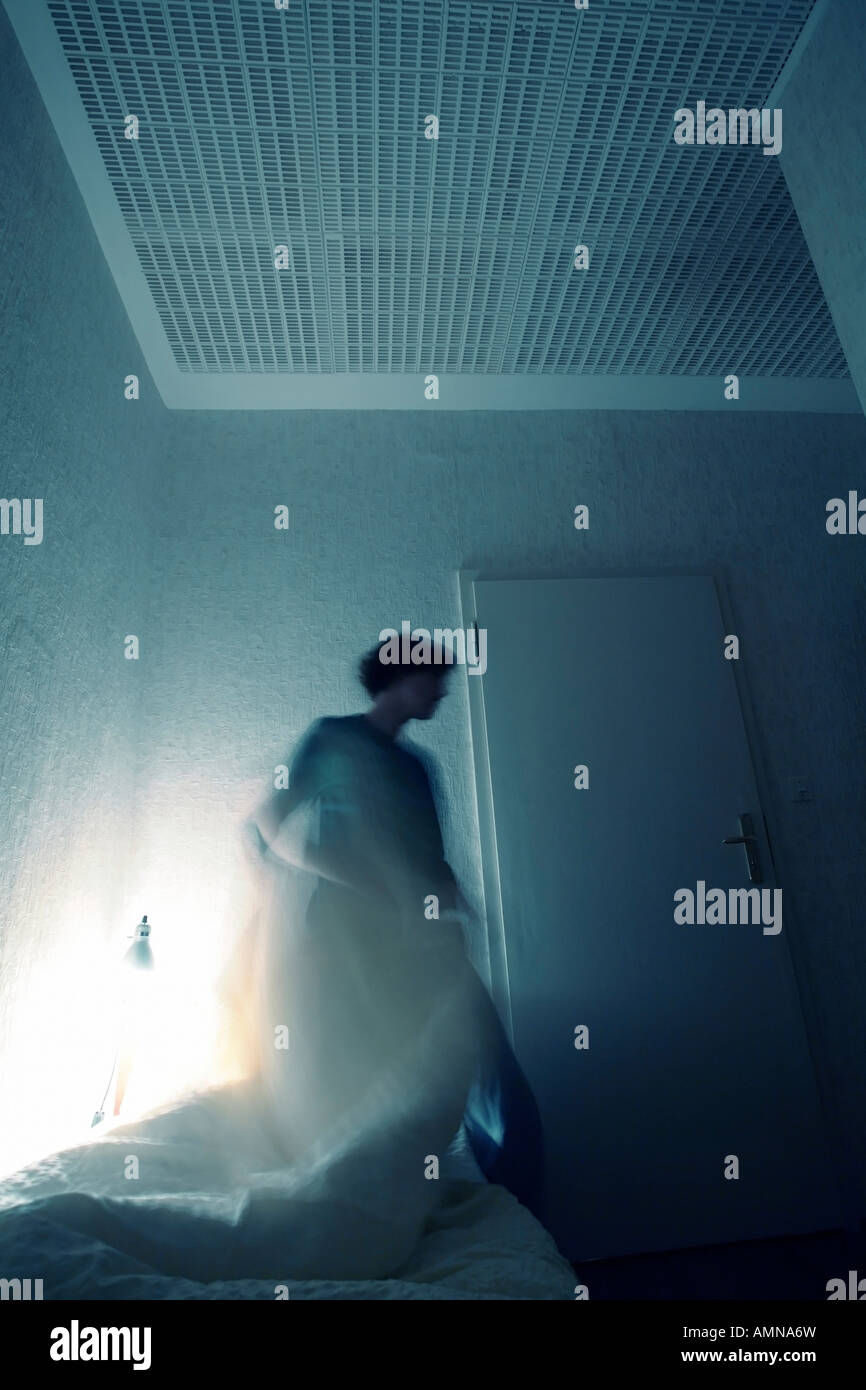 Woman getting out of bed Stock Photo - Alamy