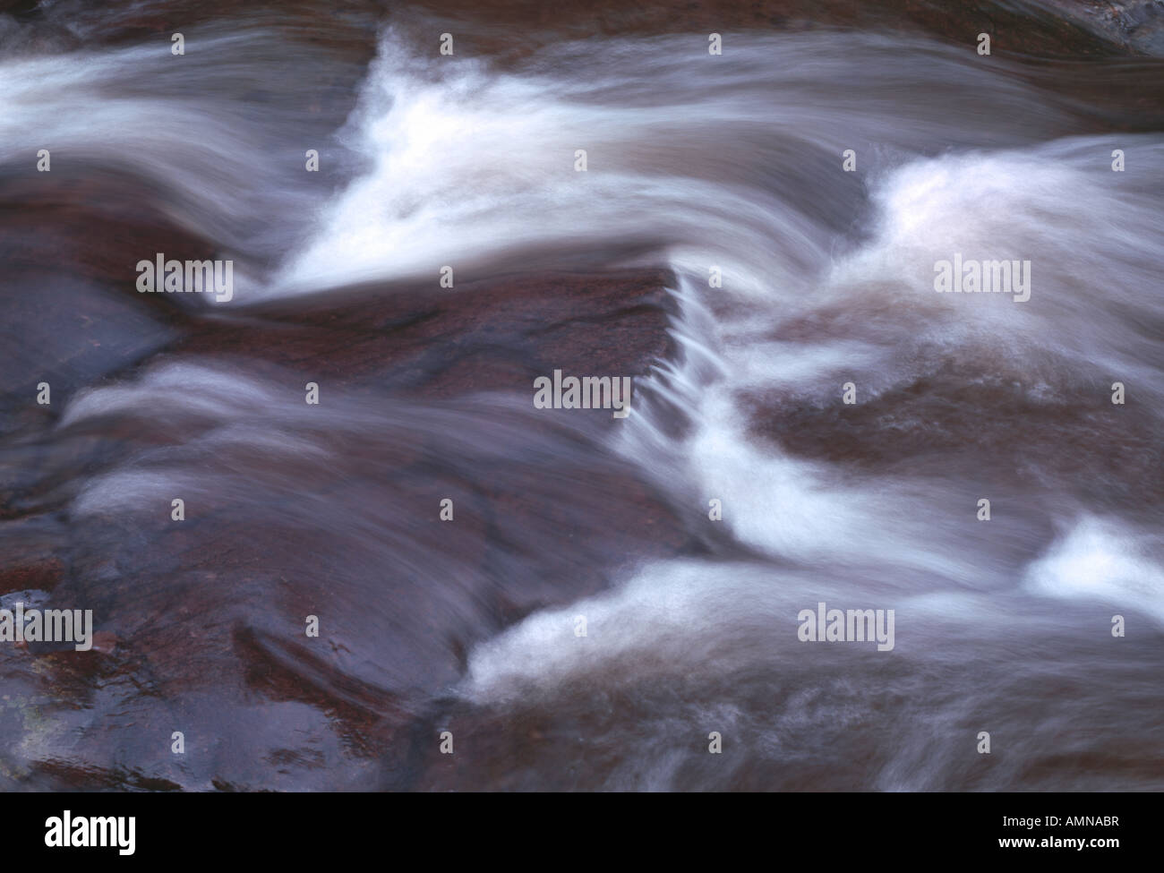 fast flowing water in mountain stream Stock Photo - Alamy