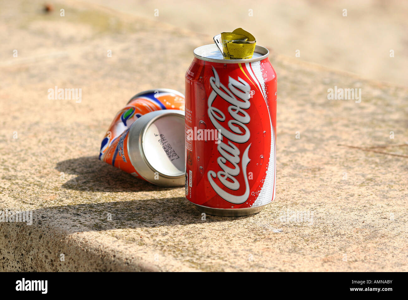 Two empty drink cans left on a wall top as litter in Palma Nova Stock ...