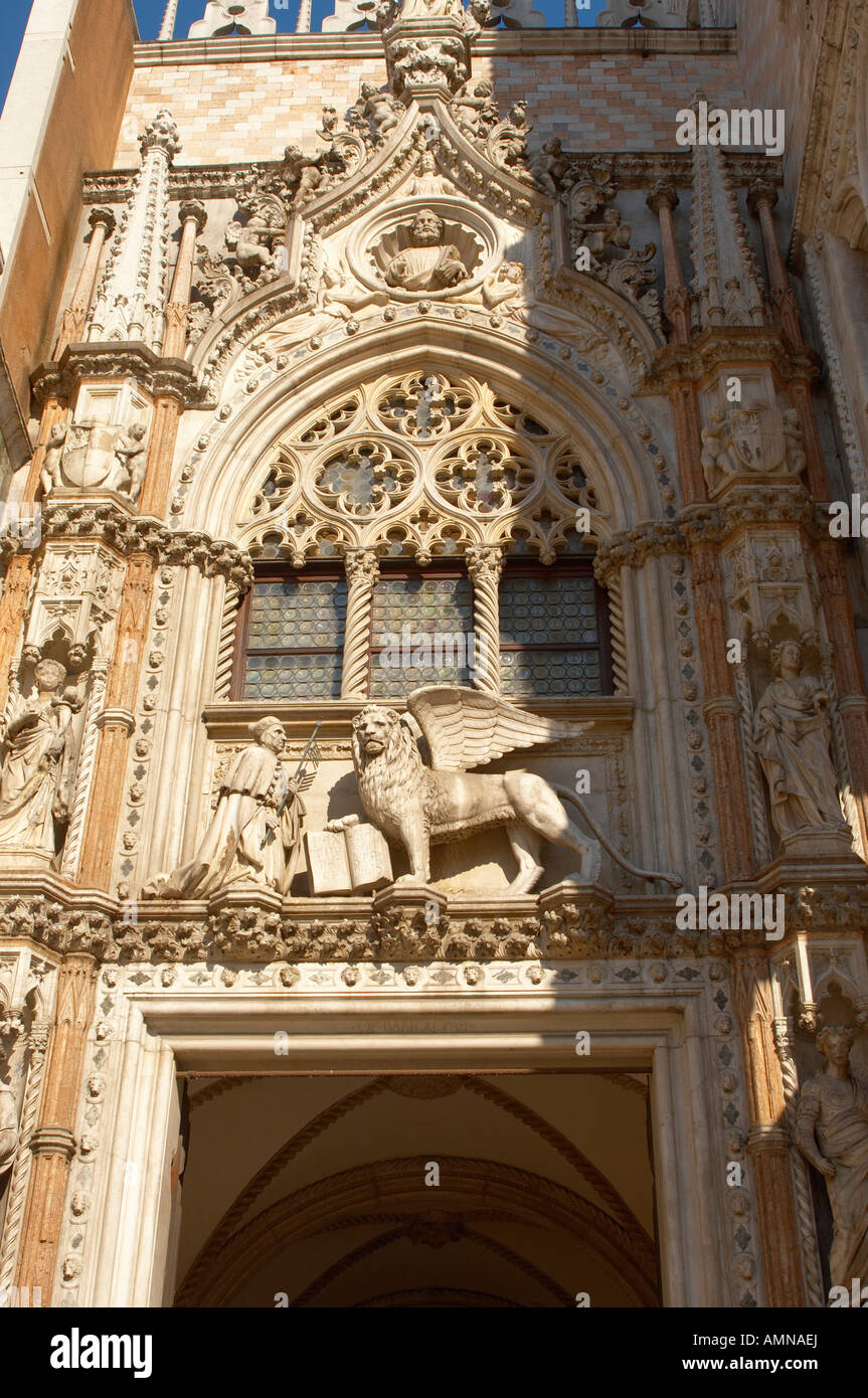 Venice, Italy. Winged lion and Doge statue over the door of the Doge's ...