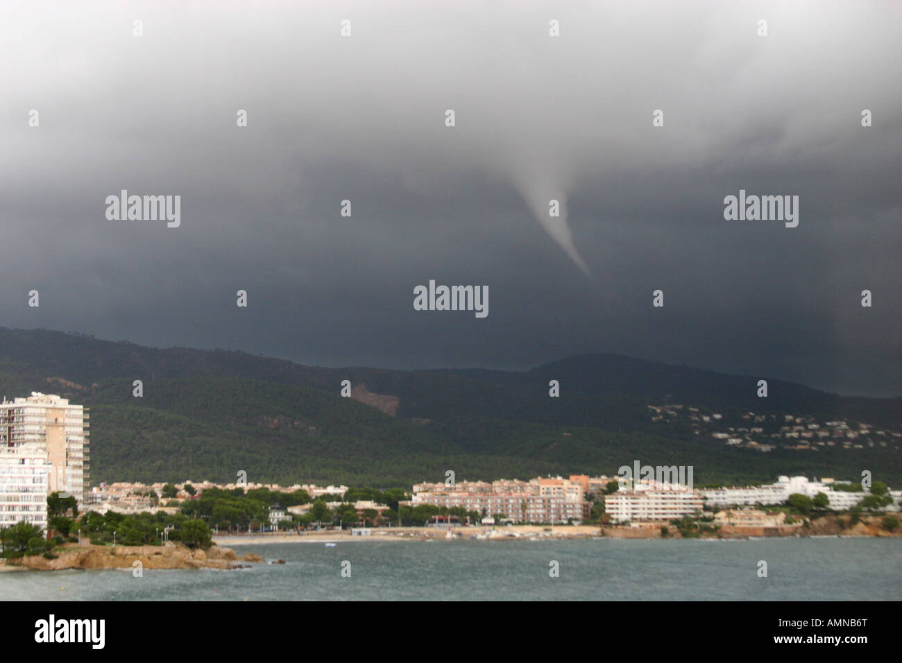 Tornado moving along mountain side during heavy storm in Palma Nova ...