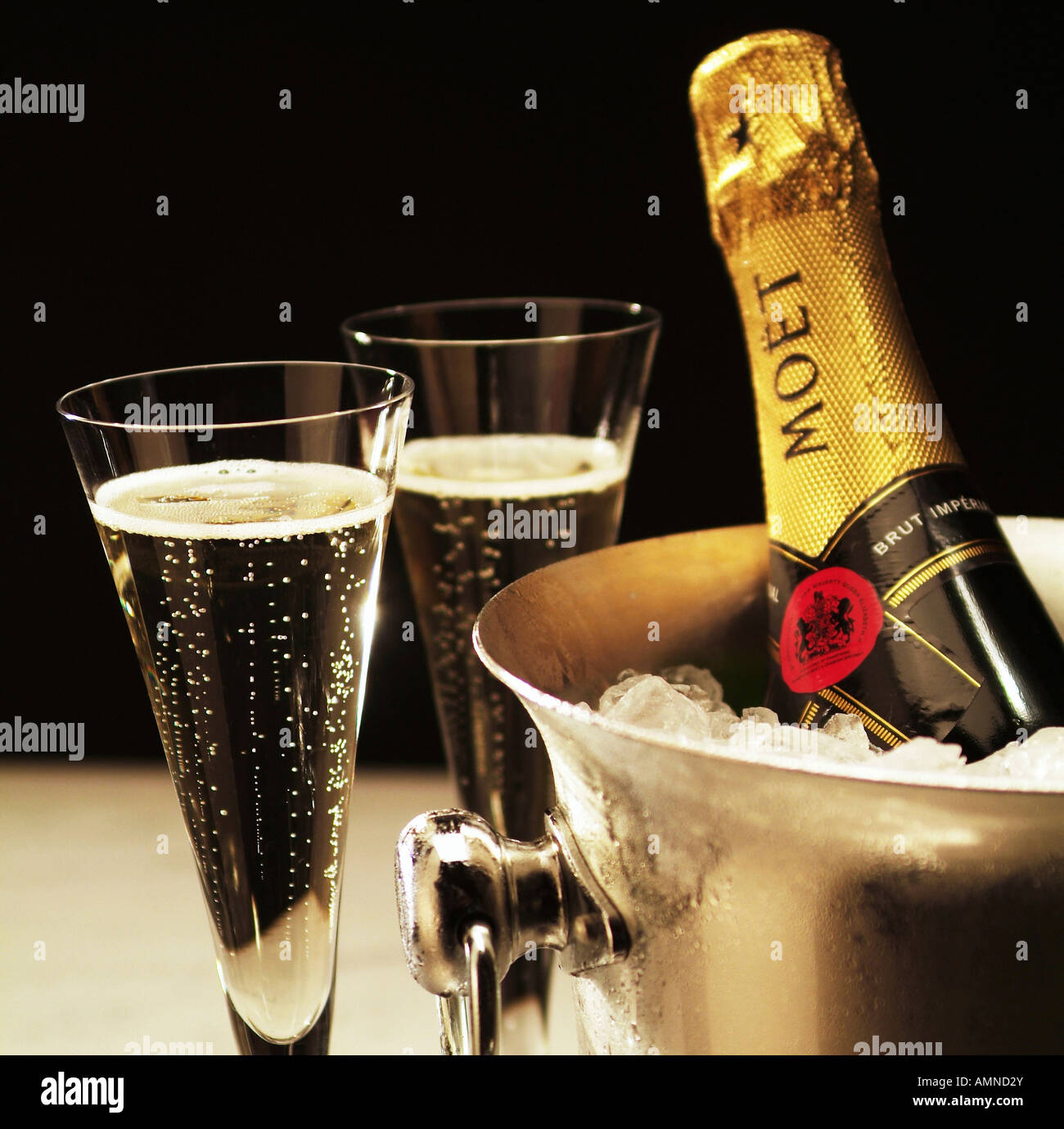 Champagne glasses and a champagne bottle in an ice bucket Stock Photo ...
