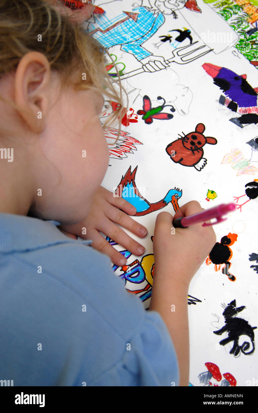 Child working on a drawing Stock Photo - Alamy