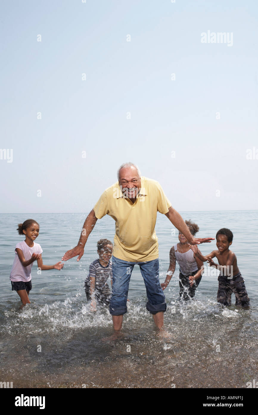 People being splashed water water hi-res stock photography and images ...