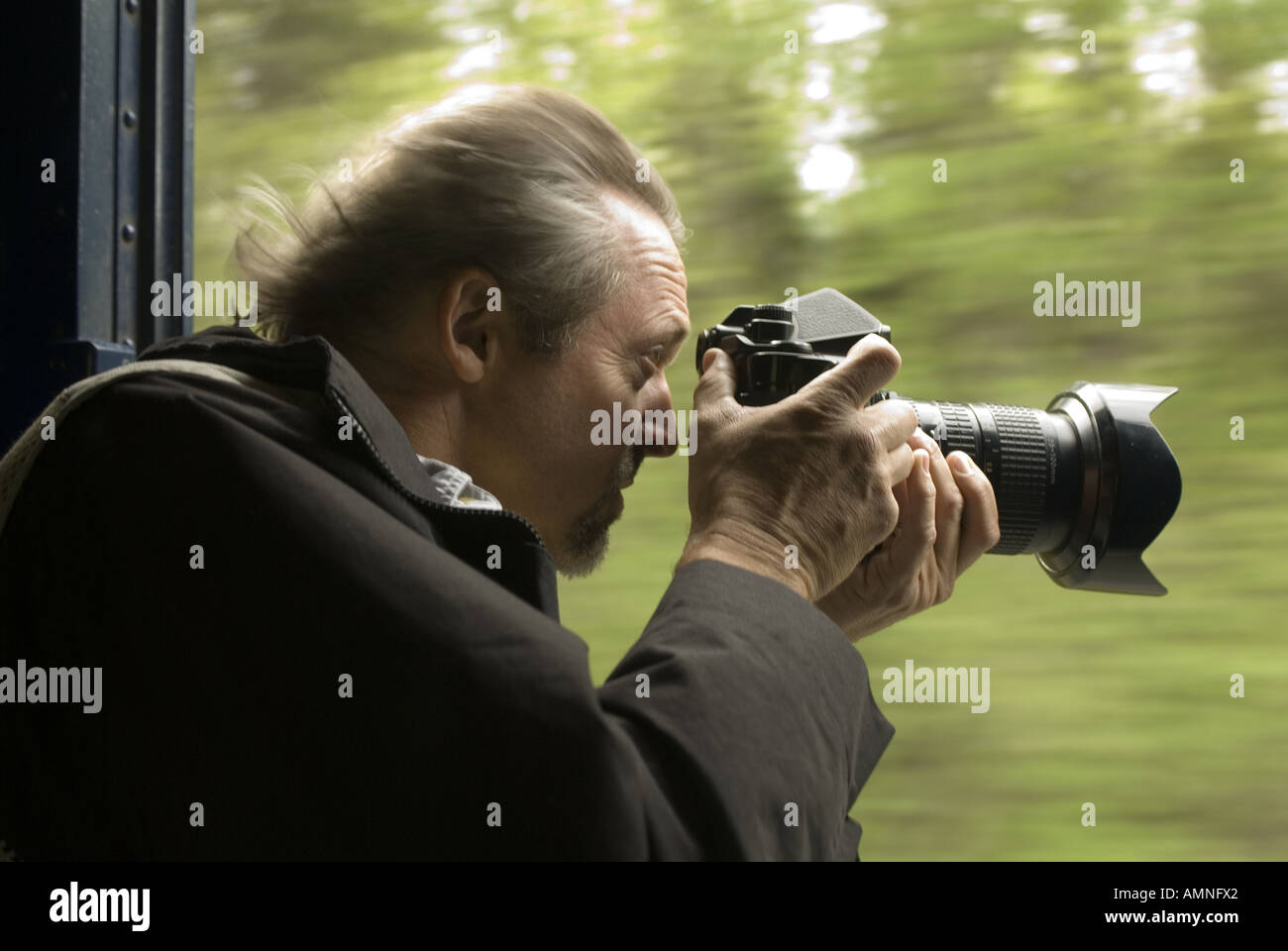 ALASKA PHOTOGRAPHER TAKING PICTURE OUT OF OPEN AIR RAIL CAR ALASKA ...
