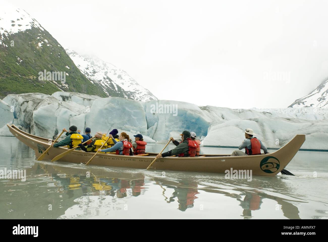 ALASKA SPENCER GLACIER PEOPLE PADDELING ESKIMO CANOES ON GLACIER LAKE ...