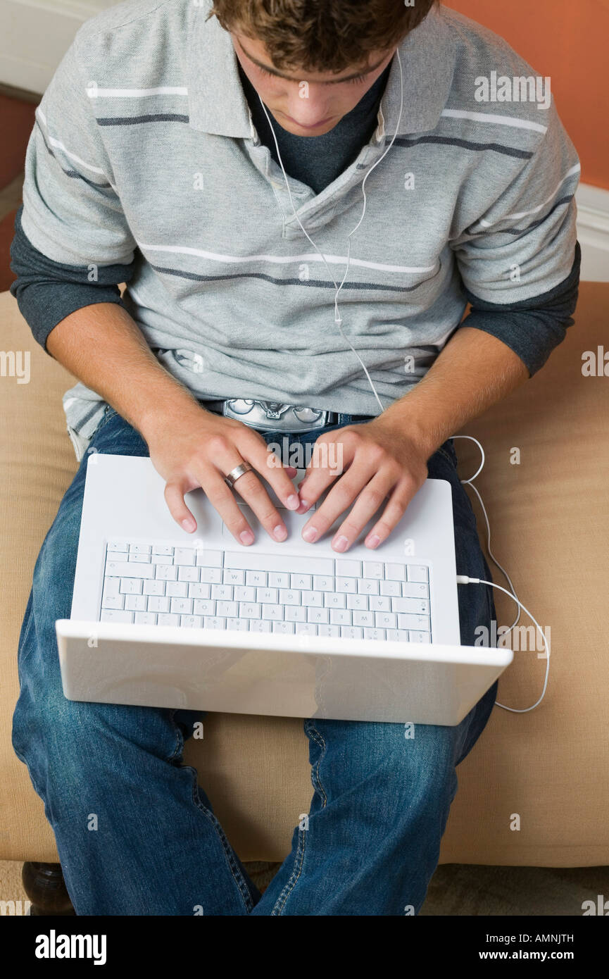 Teenage Boy Using Laptop Stock Photo - Alamy