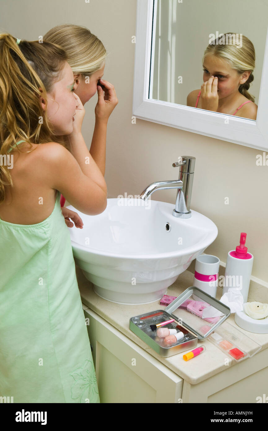 Girls Applying Make-up Stock Photo - Alamy