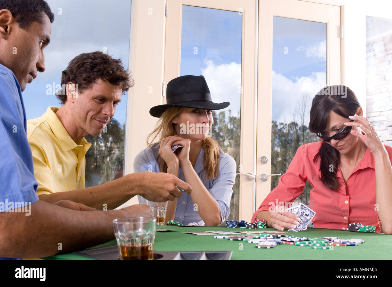 Group of adults playing cards Stock Photo - Alamy