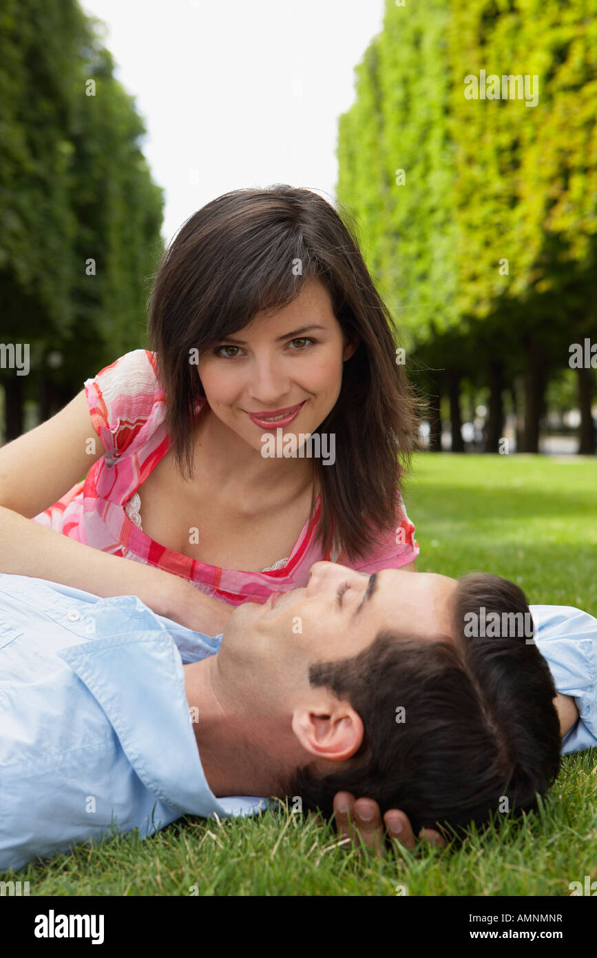Young woman lying down facing camera hi-res stock photography and images - Alamy