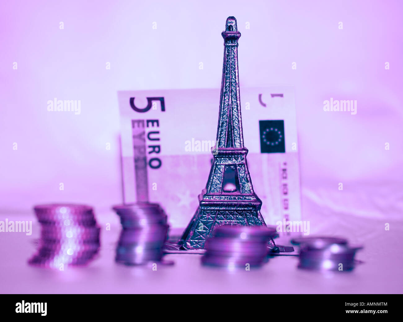Eiffel tower and Euro money in pink Stock Photo - Alamy