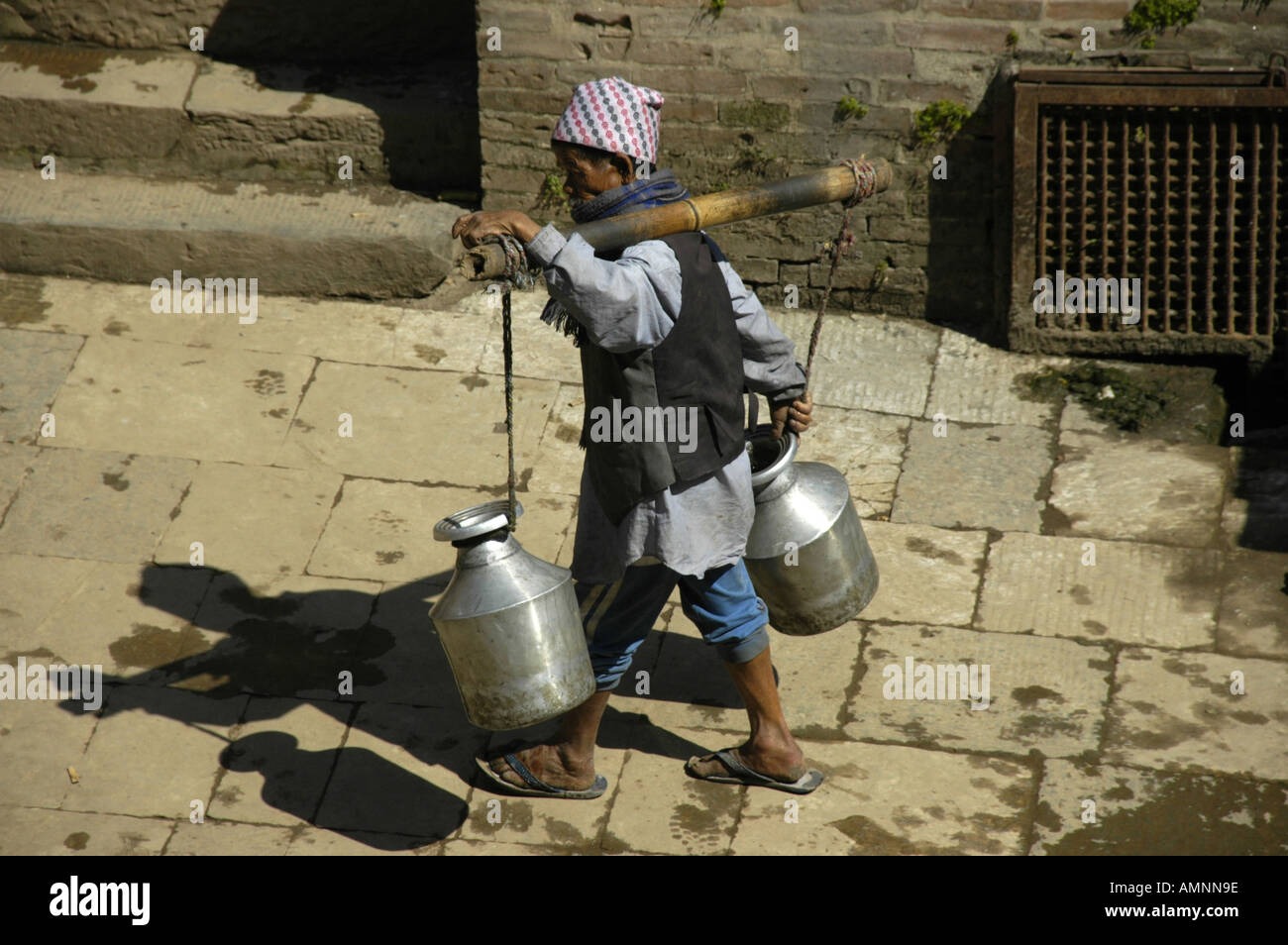 Carrying water pot on shoulder hi-res stock photography and images - Alamy