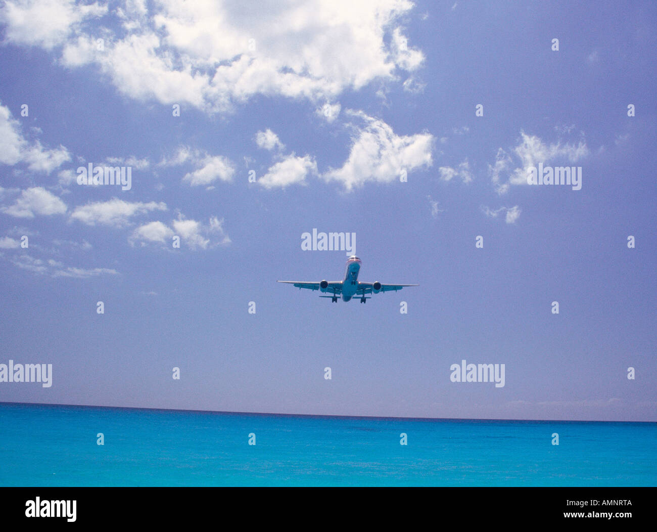 Plane over Water Stock Photo - Alamy