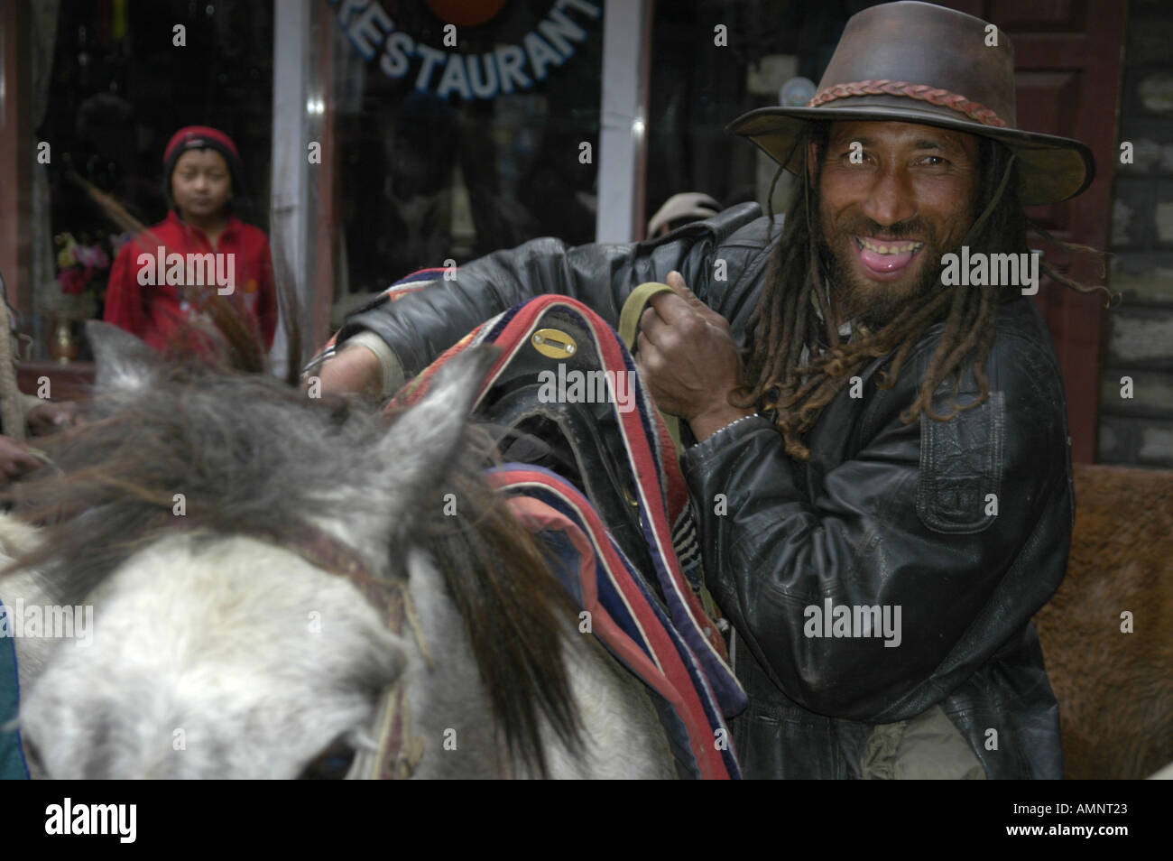 Laughing Nepali cowboy with rasta hairs leather hat and leather jacket ...