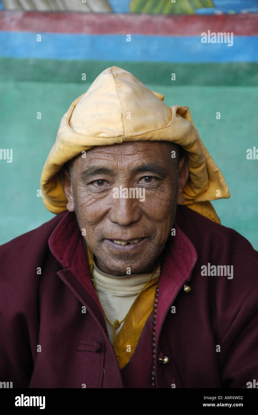 Buddhist monk lama wearing a yellow cap of Sakya pa sect in the old ...