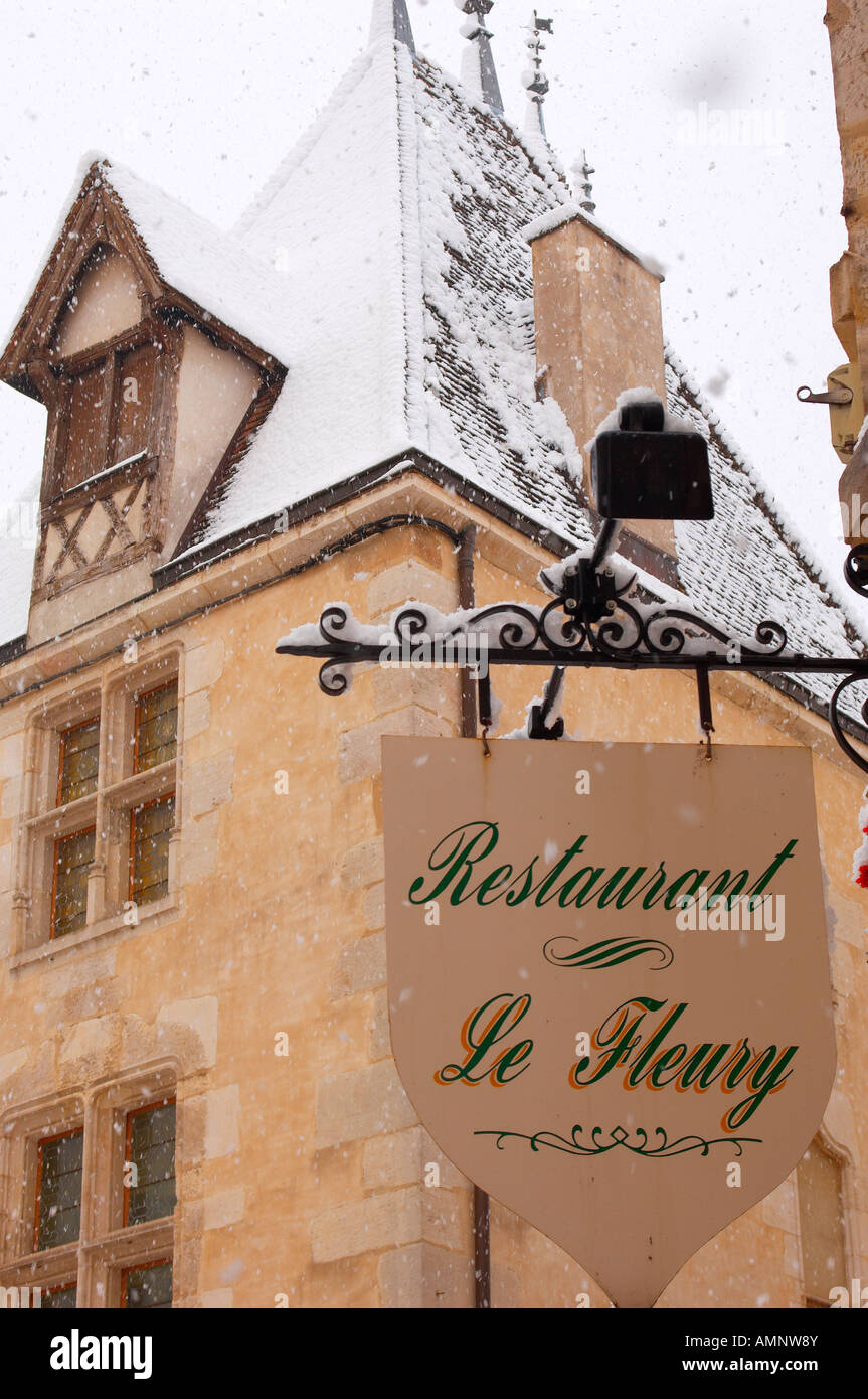 Typical Turrets and restaurant sign with heavy snow falling in winter ...