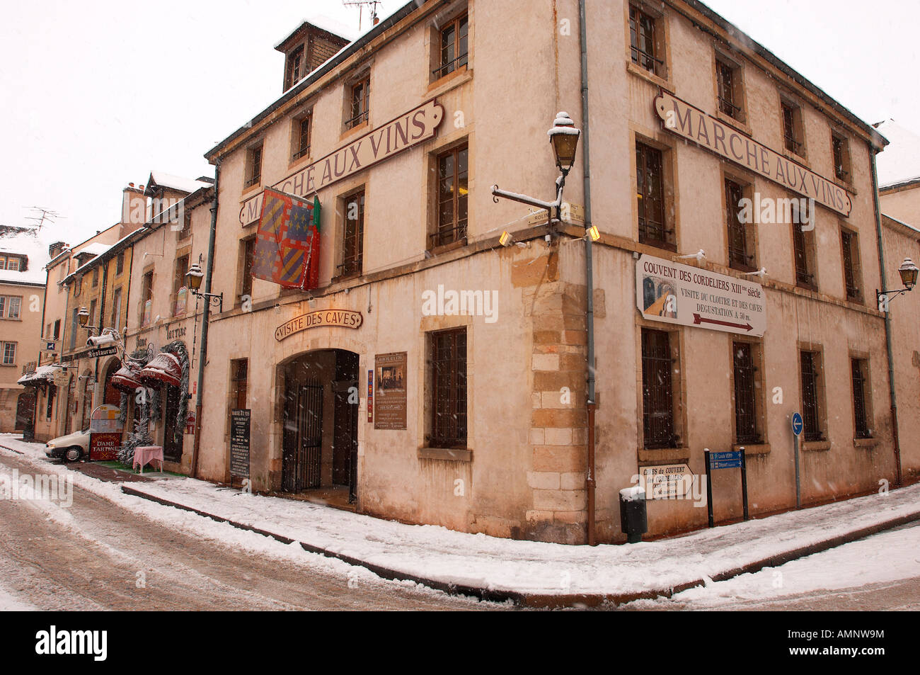 Marche au Vin and street scene with heavy snow falling in winter ...