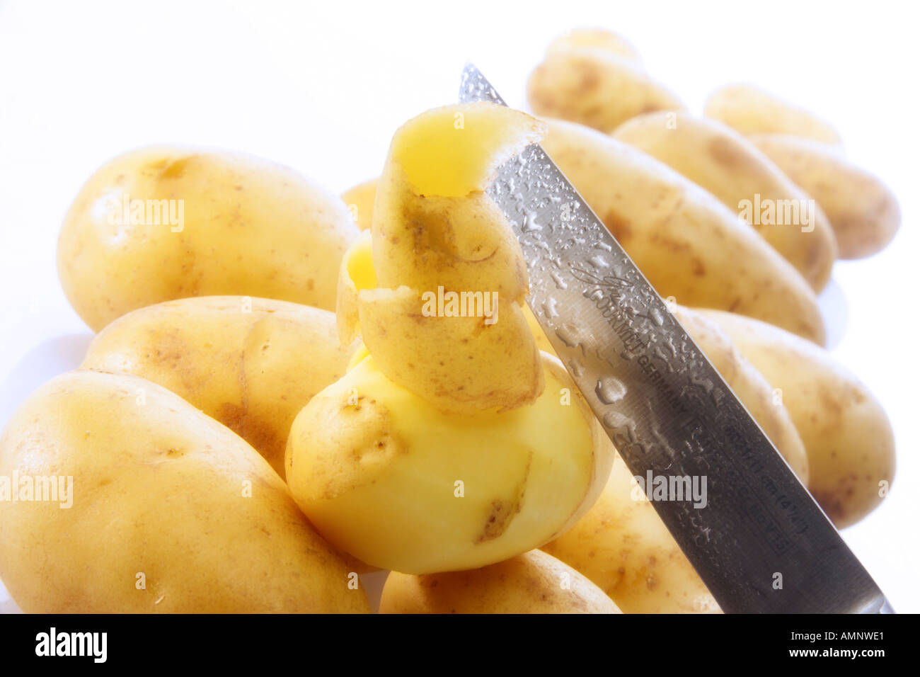 Paring potatoes hi-res stock photography and images - Alamy