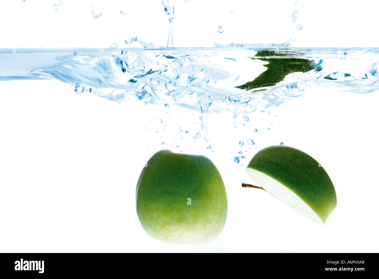 Green apples in water Stock Photo - Alamy