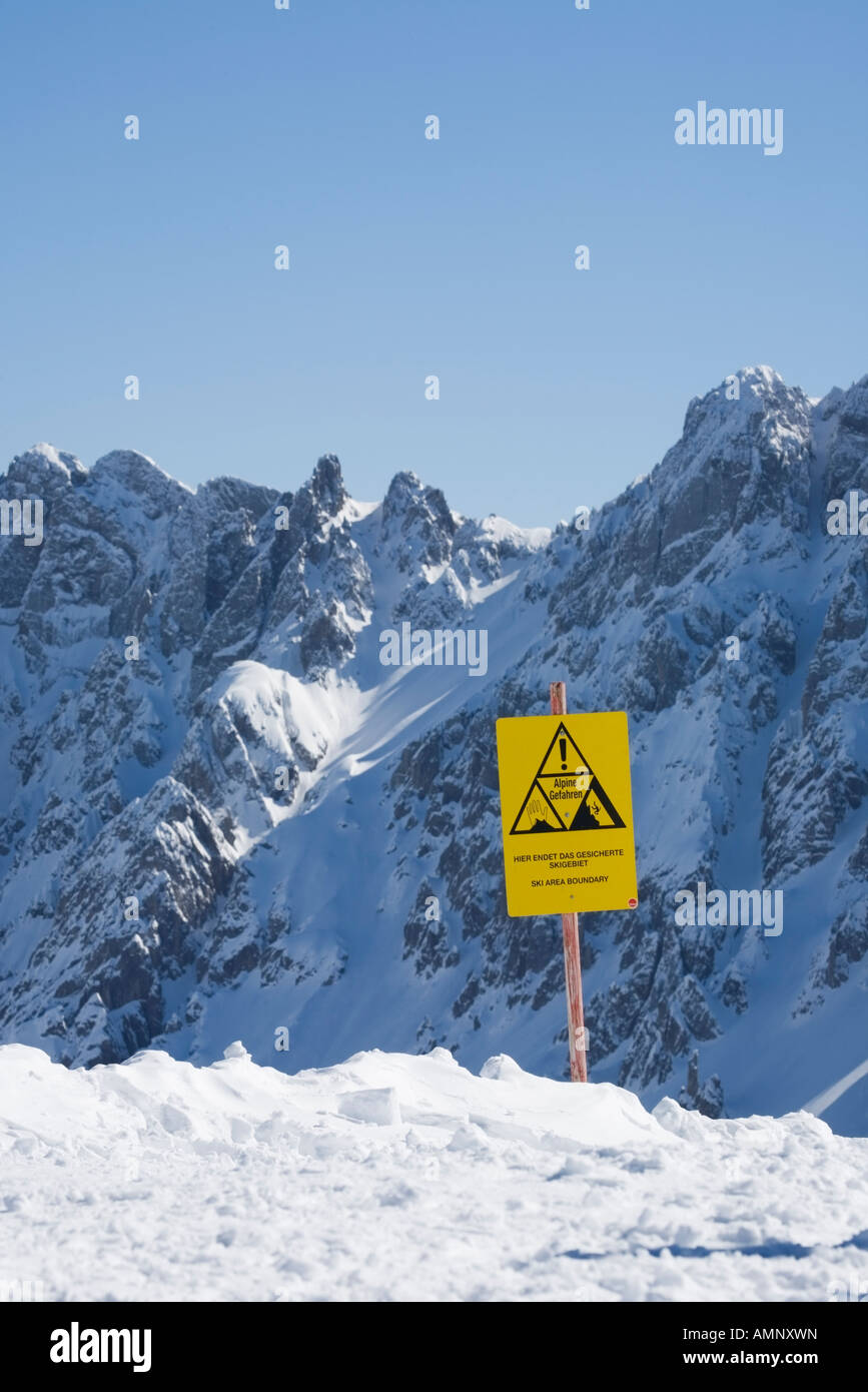 Signpost warning of danger at the top of the mountain Stock Photo - Alamy