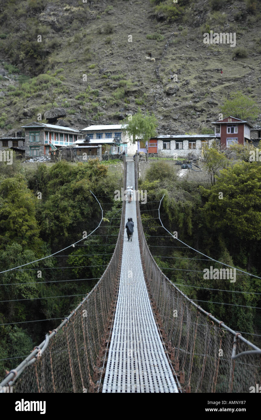 Long suspension bridge toward Karte Annapurna Region Nepal Stock Photo ...