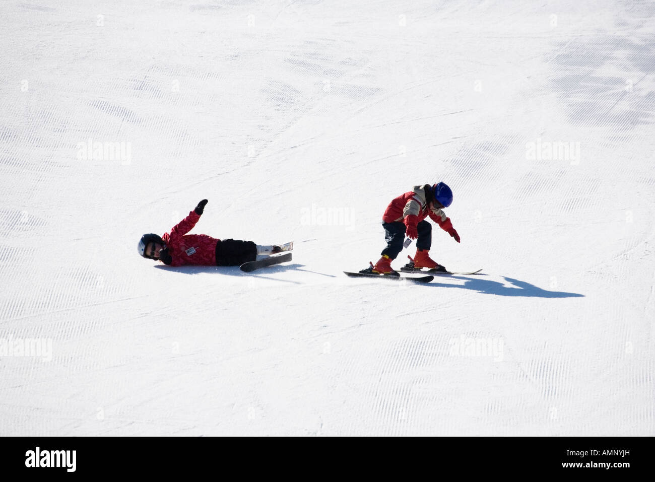 two children learning to ski Stock Photo - Alamy