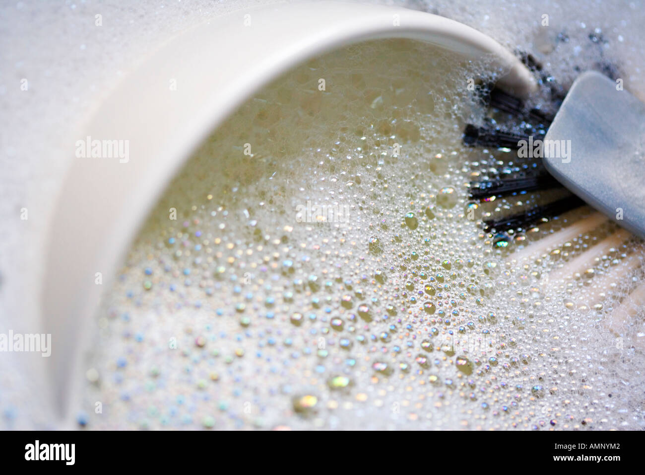 WASHING UP THE DISHES A DAILY CHORE Stock Photo - Alamy