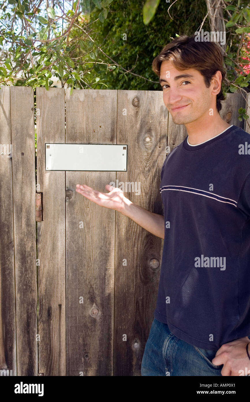 Male lean against fence hi-res stock photography and images - Alamy