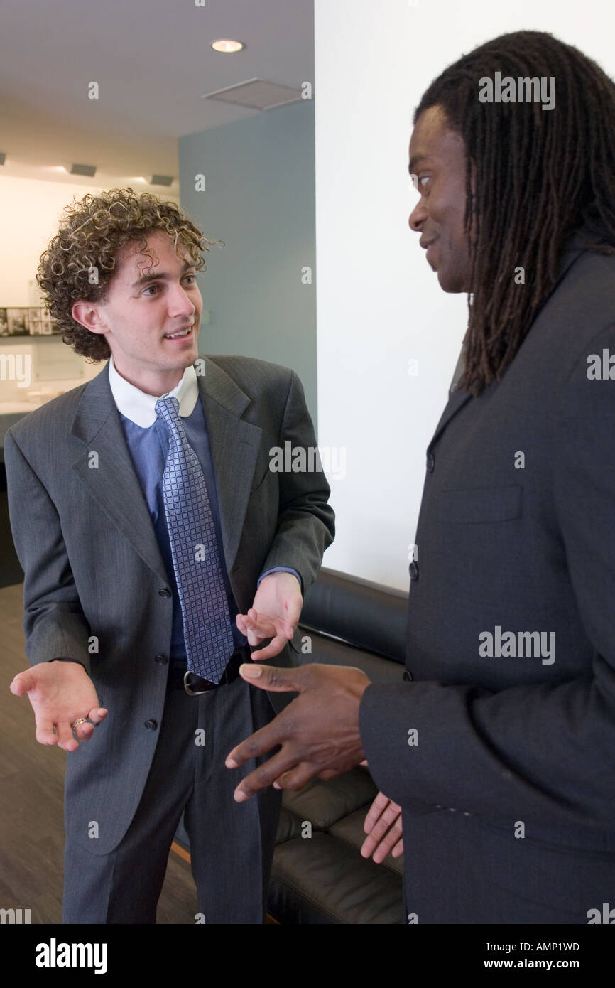 Two businessmen talking Stock Photo - Alamy
