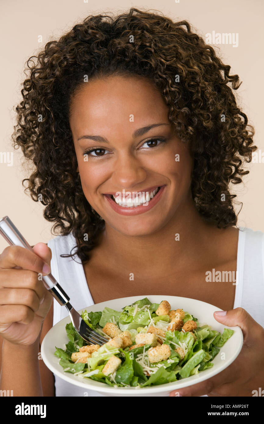 African woman eating salad Stock Photo - Alamy
