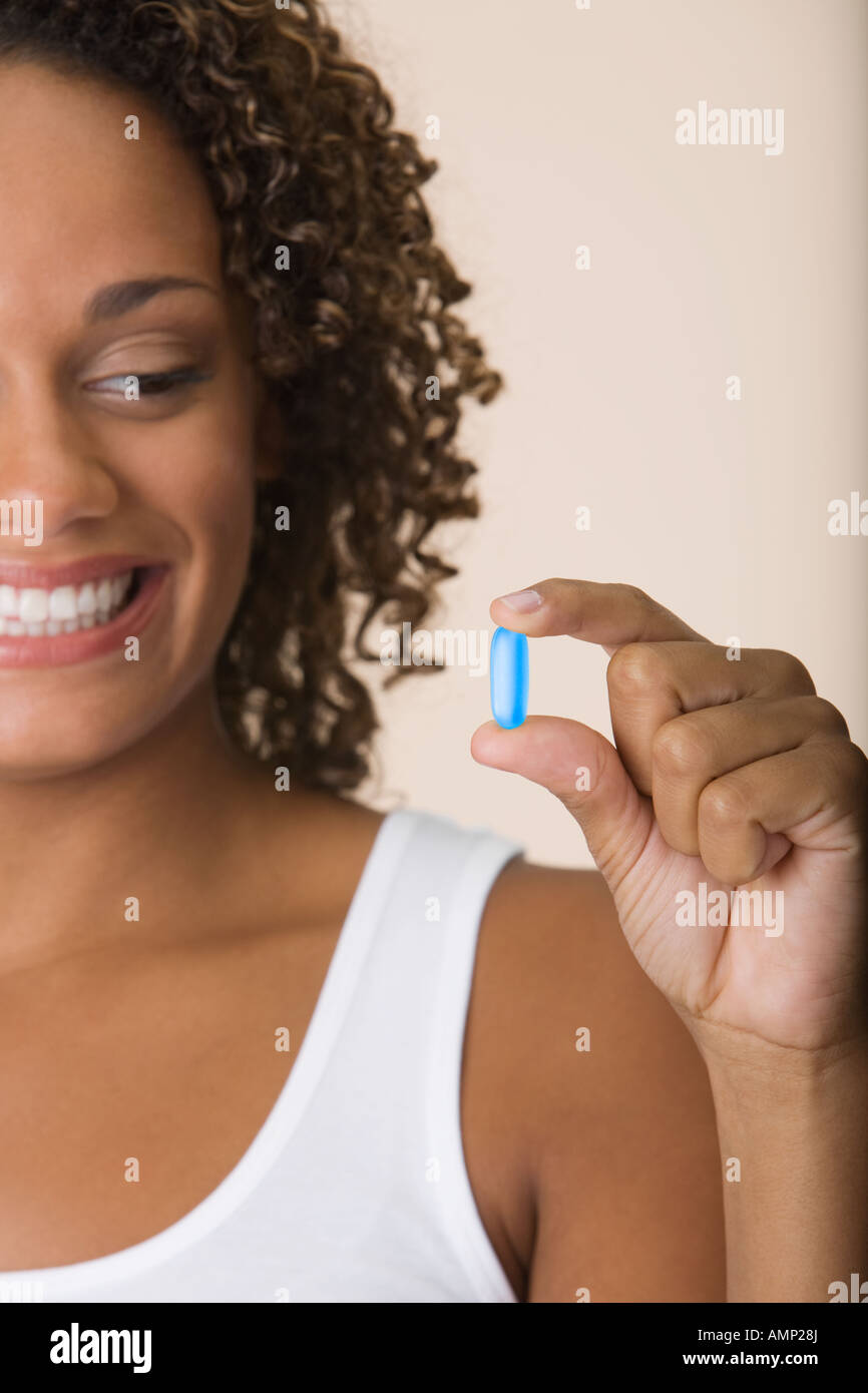 African woman holding vitamin Stock Photo - Alamy