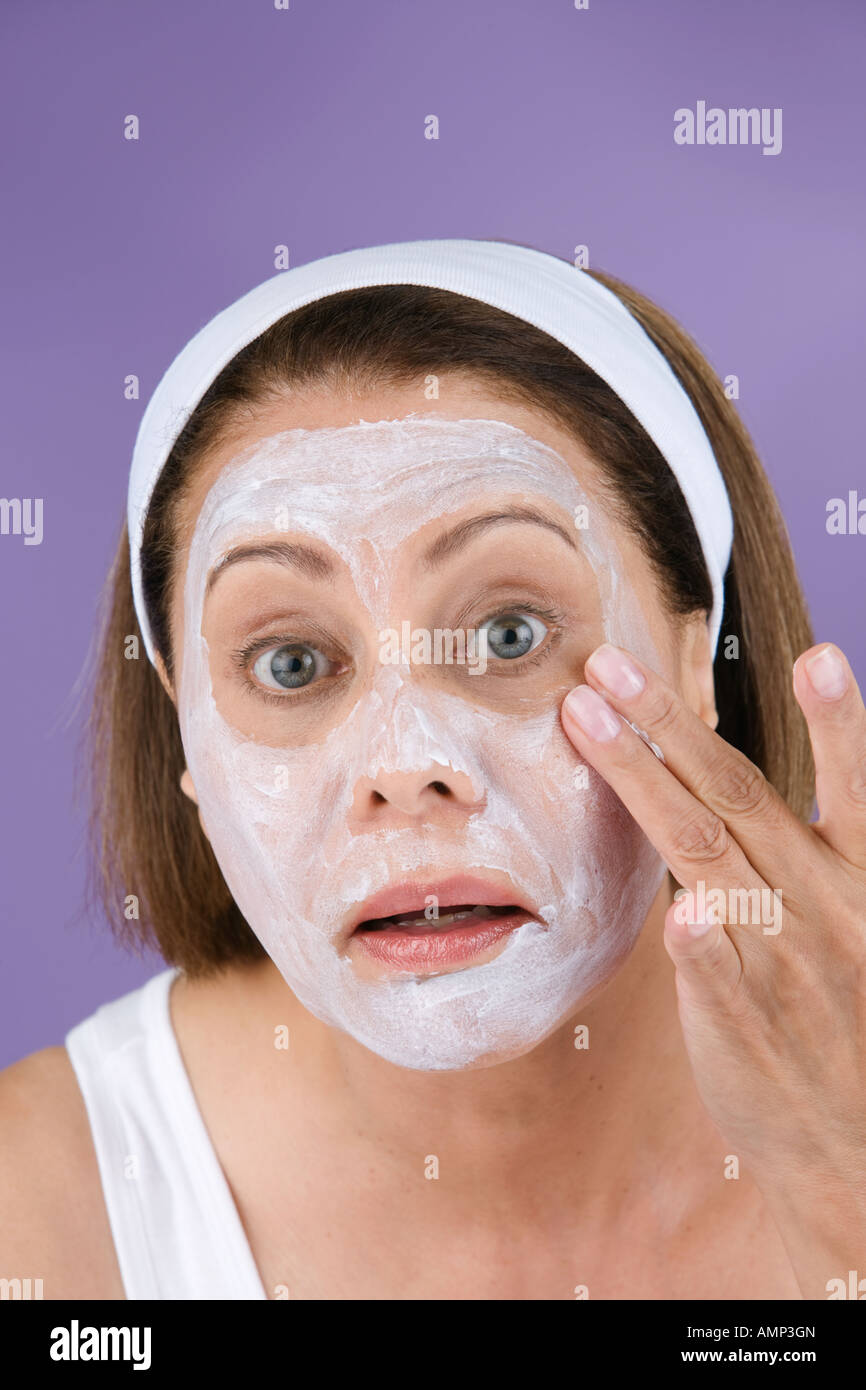 woman applying face cream Stock Photo - Alamy