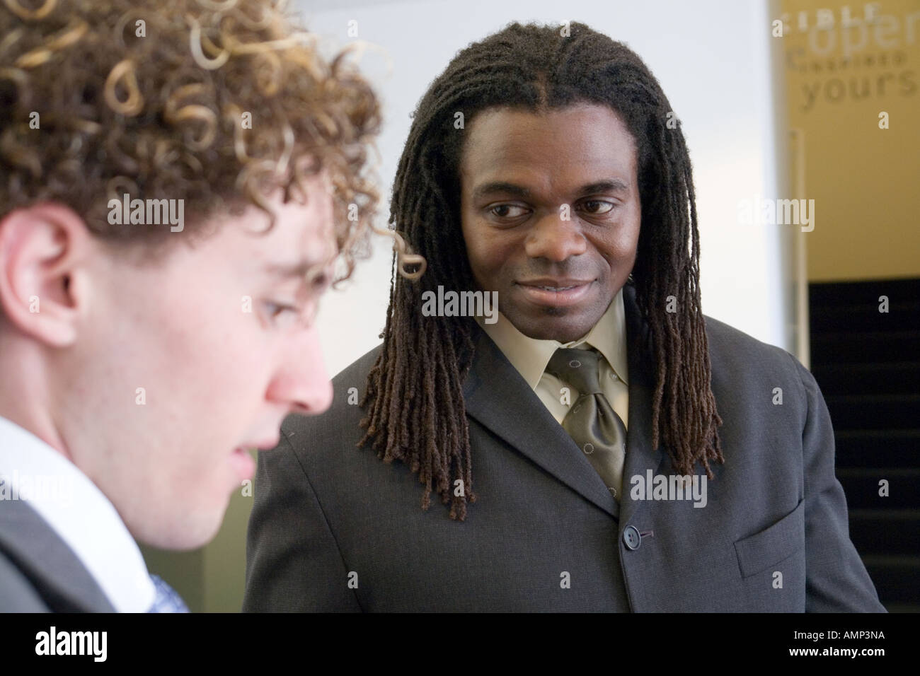 Two businessmen talking Stock Photo - Alamy