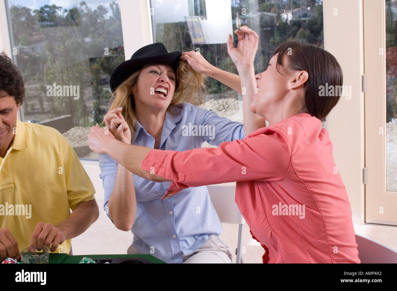Women arguing over a poker game Stock Photo - Alamy