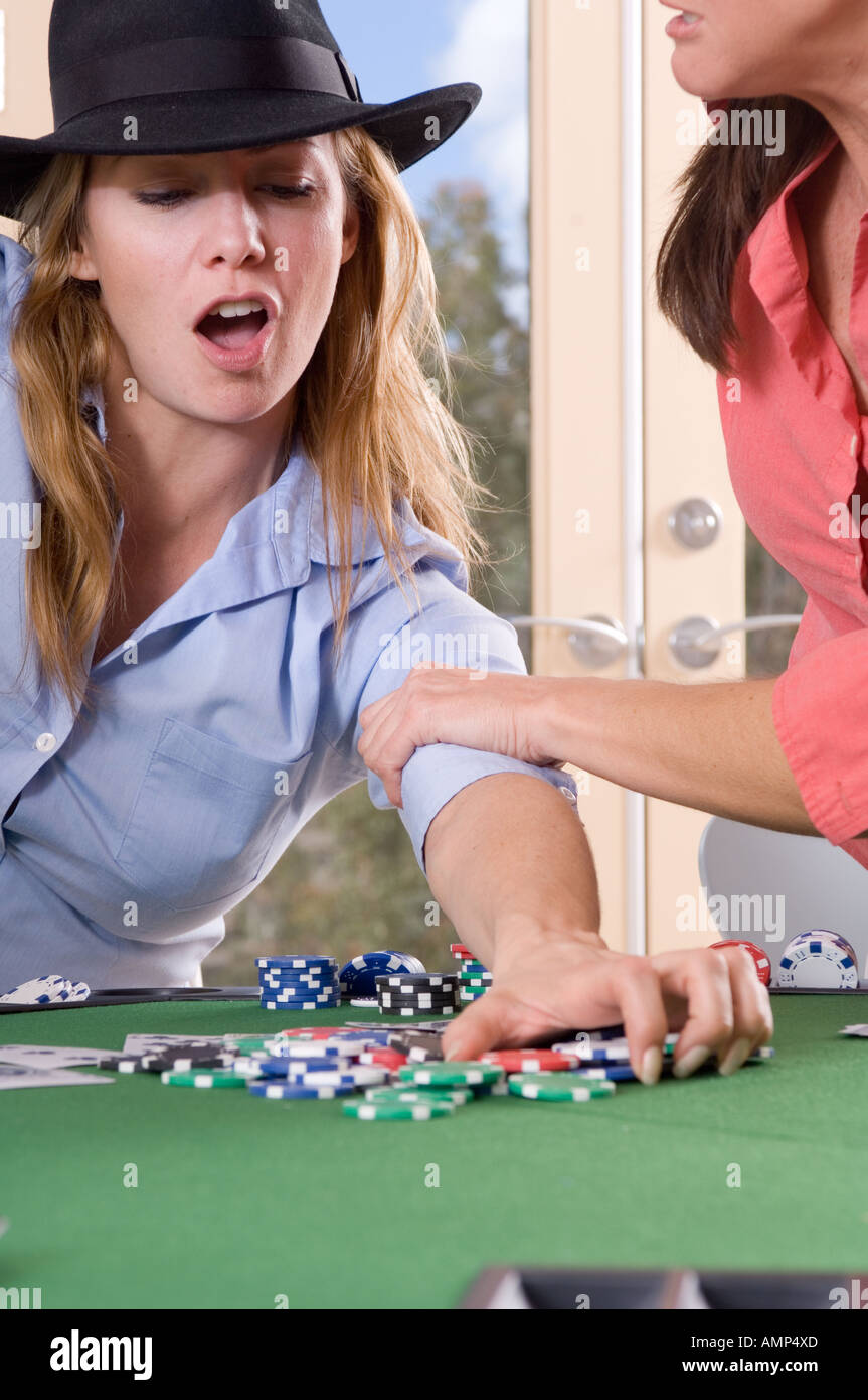 Women arguing over a poker game Stock Photo - Alamy