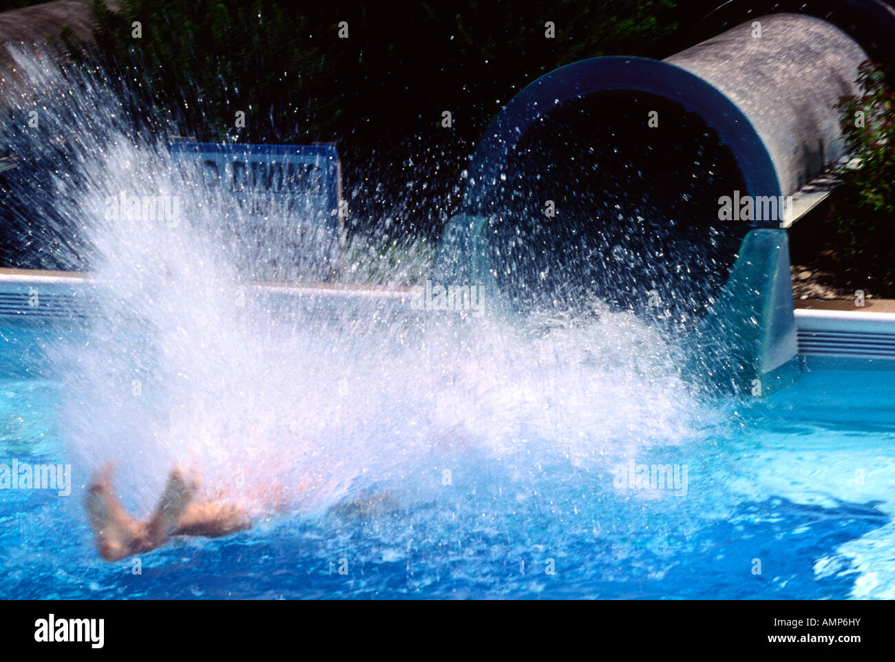 A person makes a splash exiting the water slide tube at Waldameer Park ...