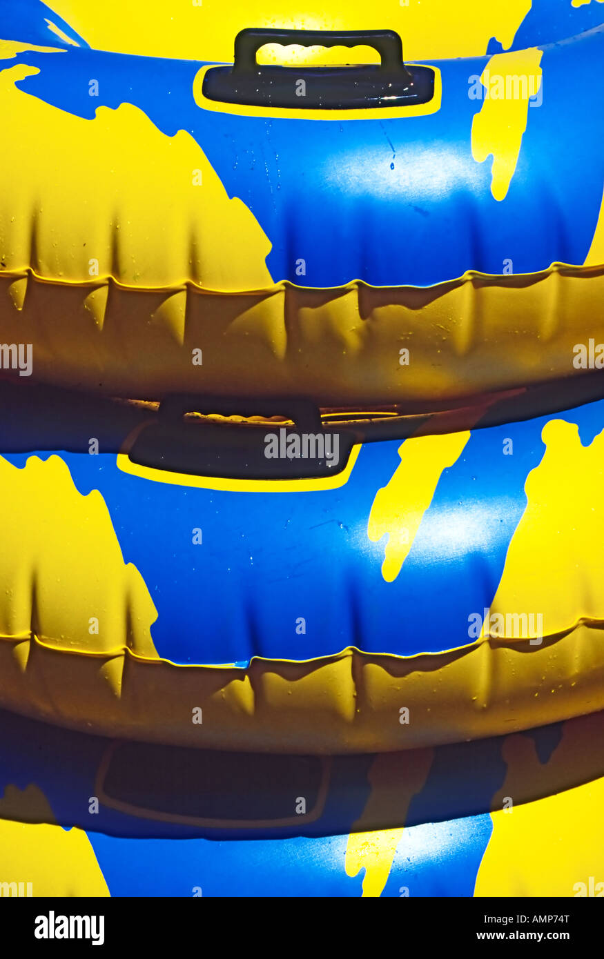 Blue and yellow round rafts for going down the waterslides Stock Photo ...