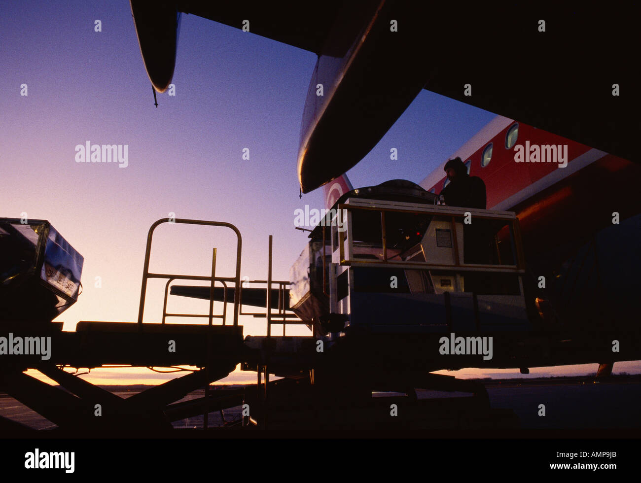 Loading luggage onto plane High Resolution Stock Photography and Images ...