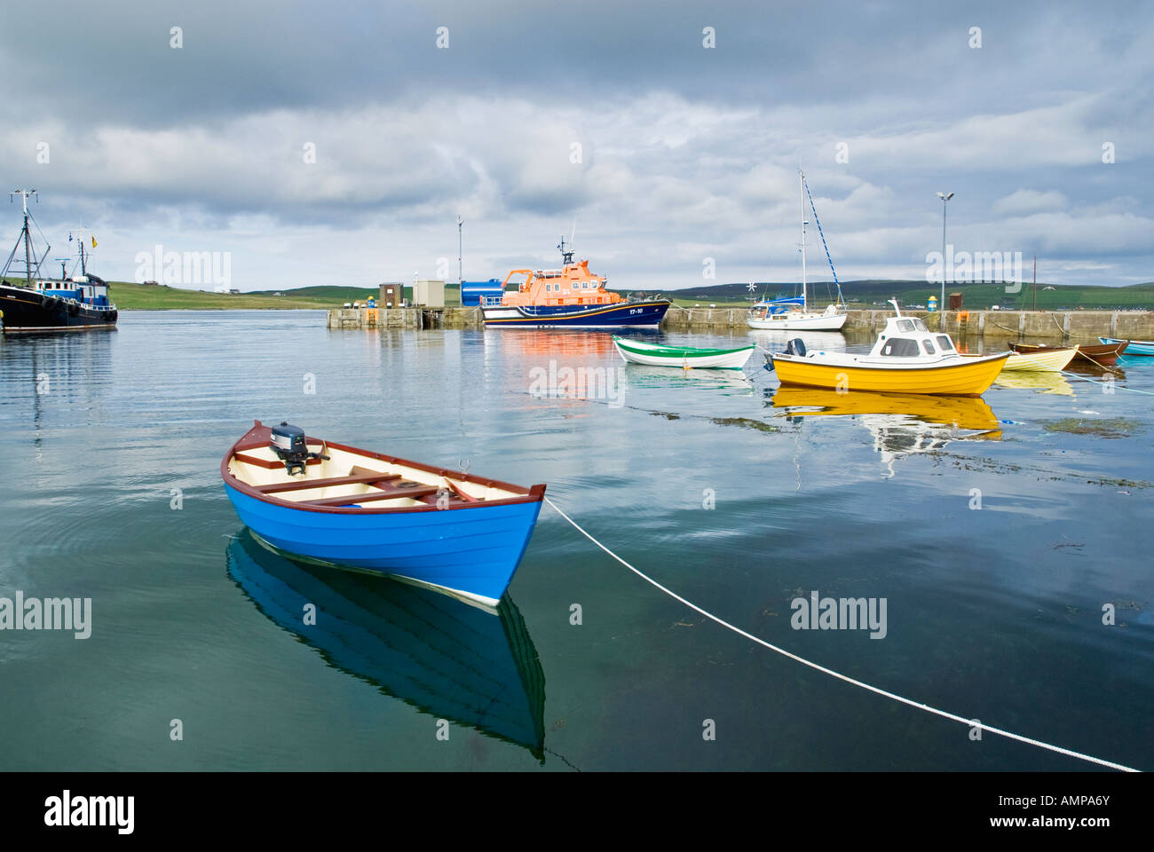 small brightly colored boat moored in Lerwick harbor, Shetland islands ...