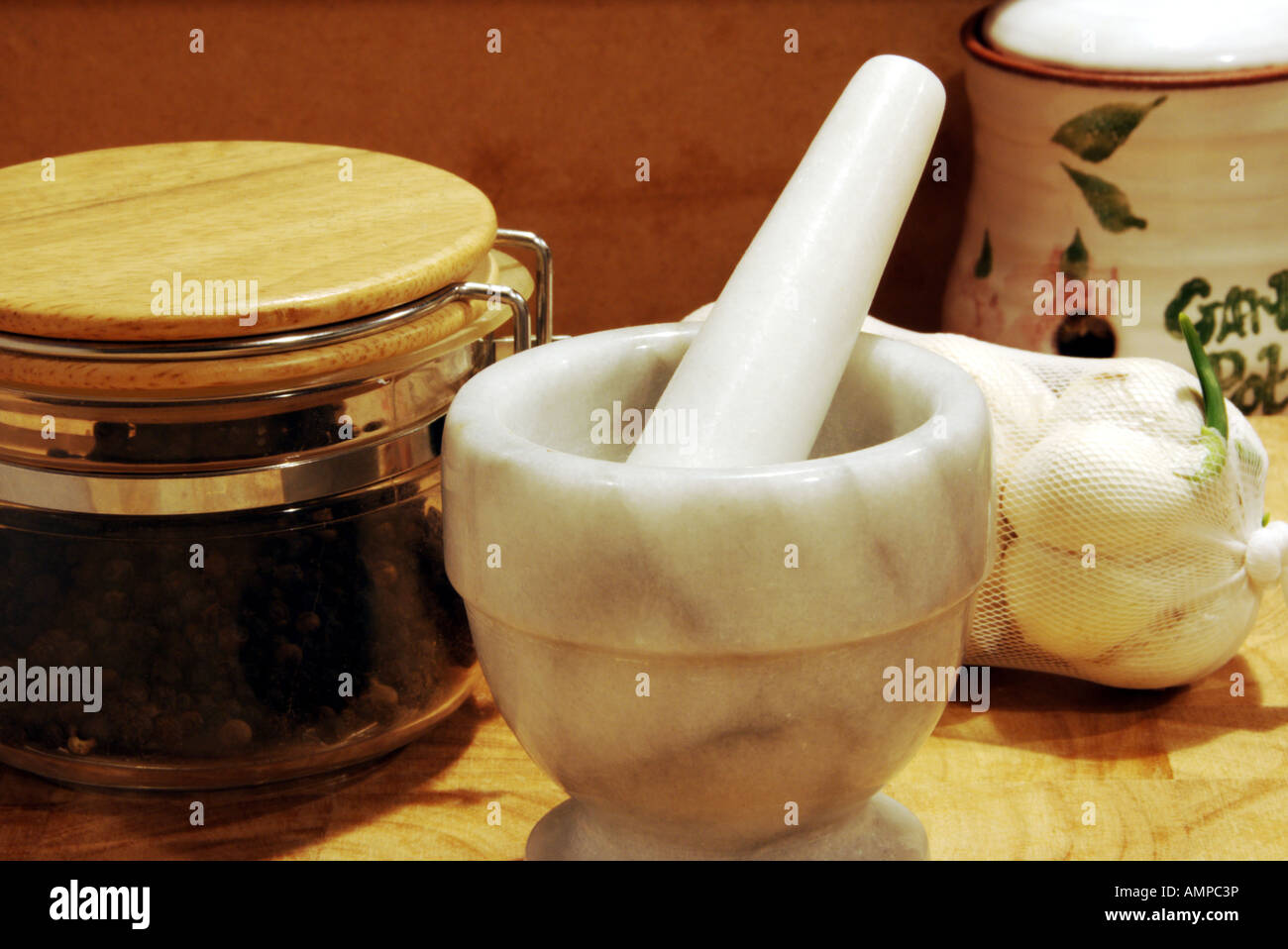 Marble Mortar and Pestle, with Garlic and Jar of Peppercorns Stock ...