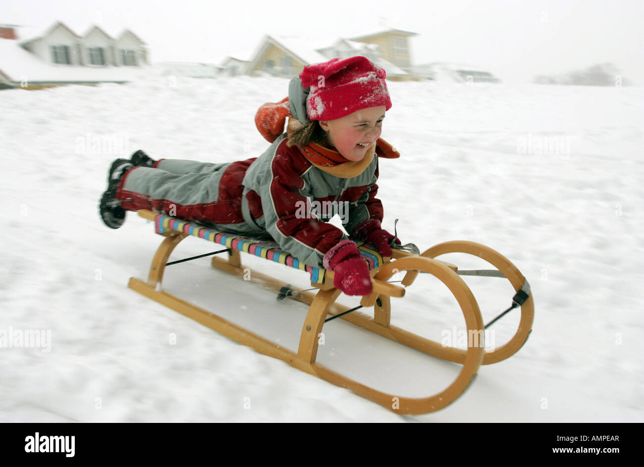 Kid on a sled Stock Photo - Alamy