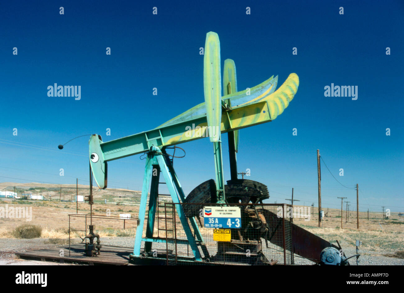Rocking Horse Oil pump jack decorated as a Grasshopper Stock Photo - Alamy
