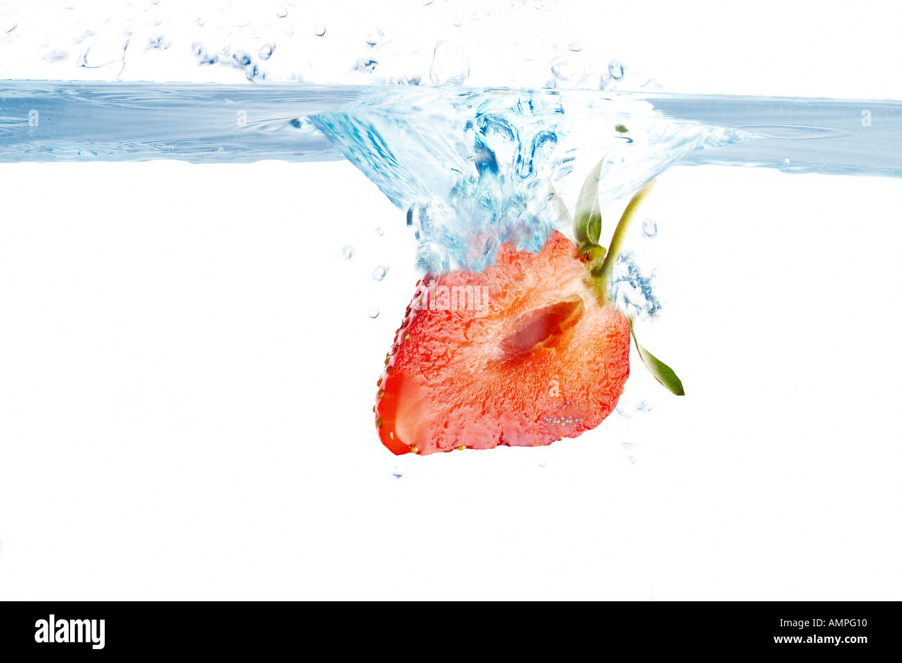 strawberry splashing into water Stock Photo - Alamy